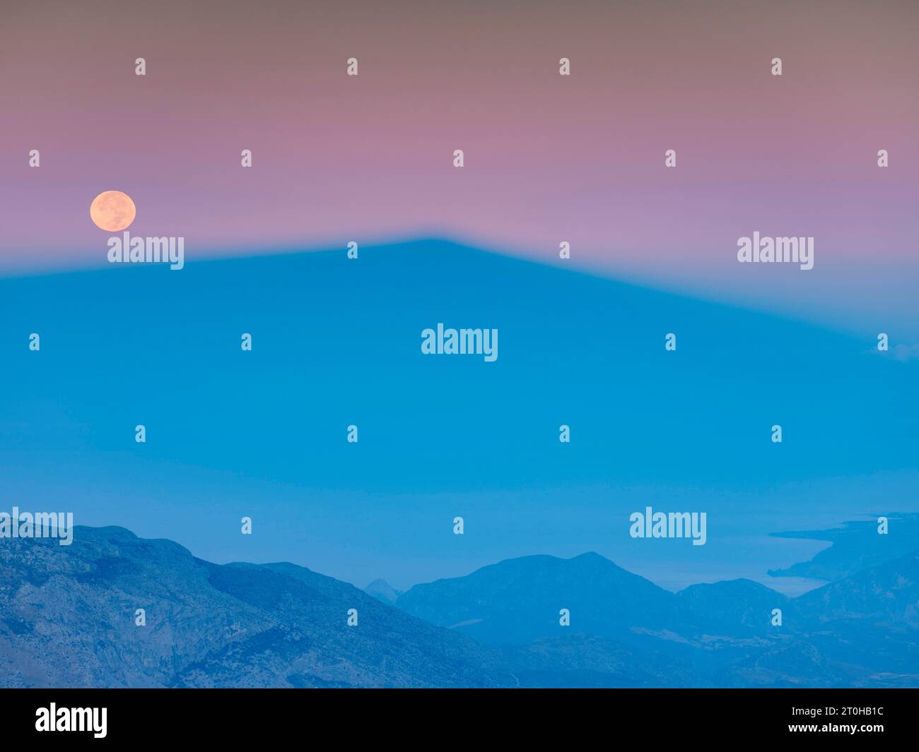 Full moon next to the shadow of Psiloritis at dawn, Ida Massif, Crete ...
