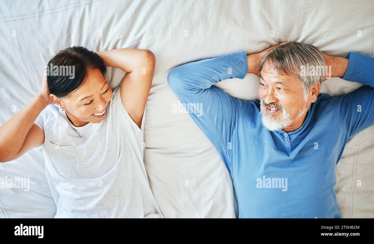 Bed, face and mature Asian couple sleeping, tired or nap for partner ...