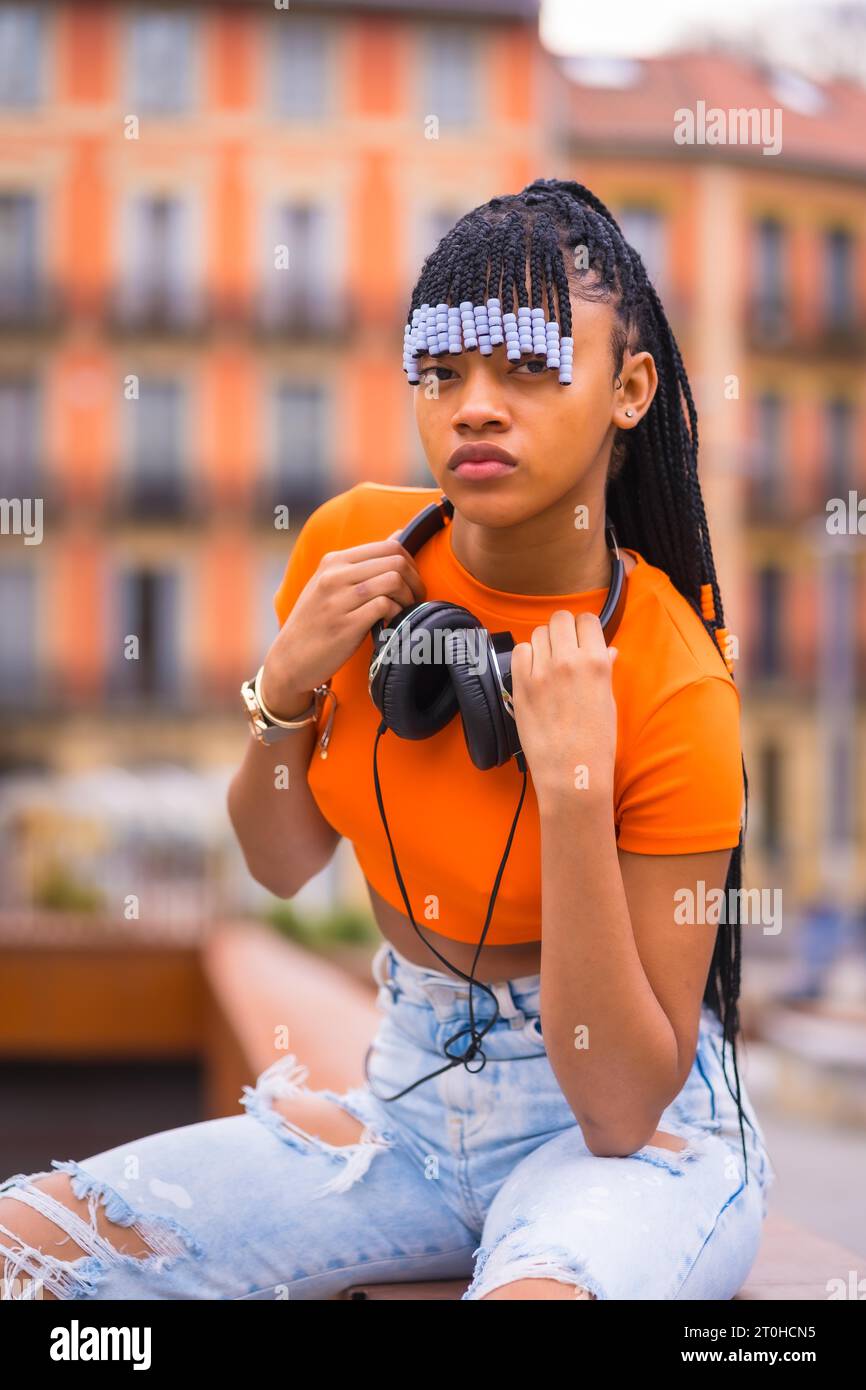 A young trap dancer with braids. She pose from the black grinding girl of African ethnic group ...