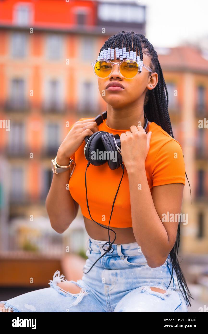 Street Style of a young trap dancer with braids. She pose from the black grinding girl of ...