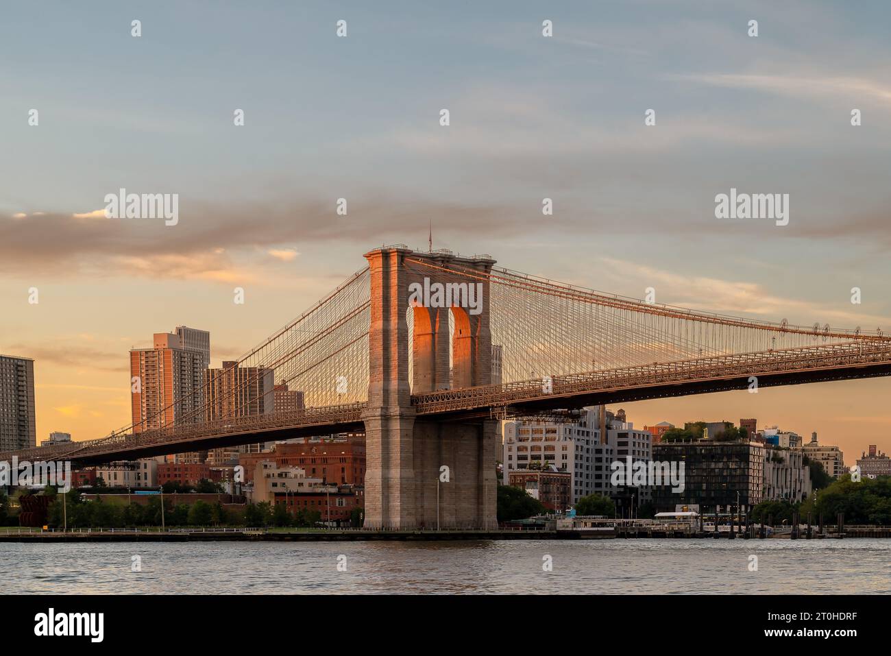 Amazing golden hour view about the Giant Brooklyn bridge over the East ...
