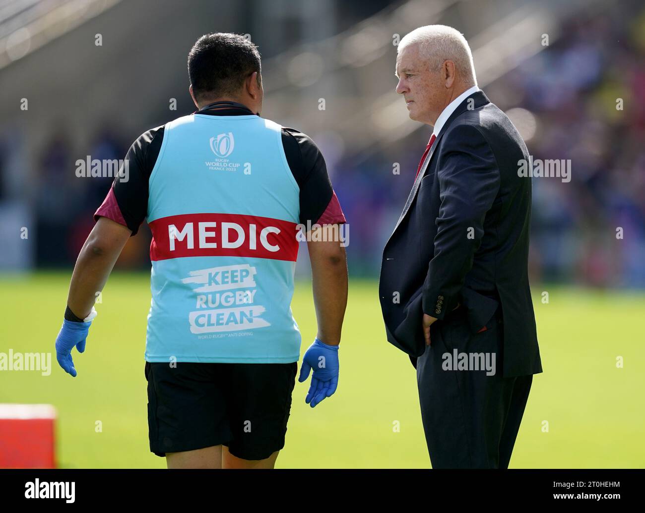 Wales' head coach Warren Gatland with a member of the medical team ...