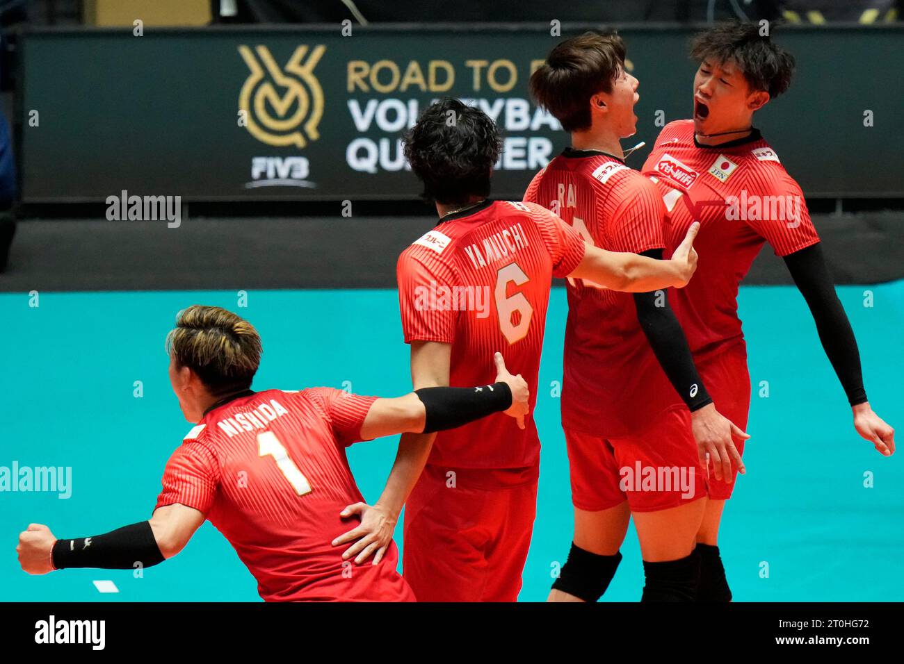 Japanese men's volleyball team celebrate a point won over Slovenia ...