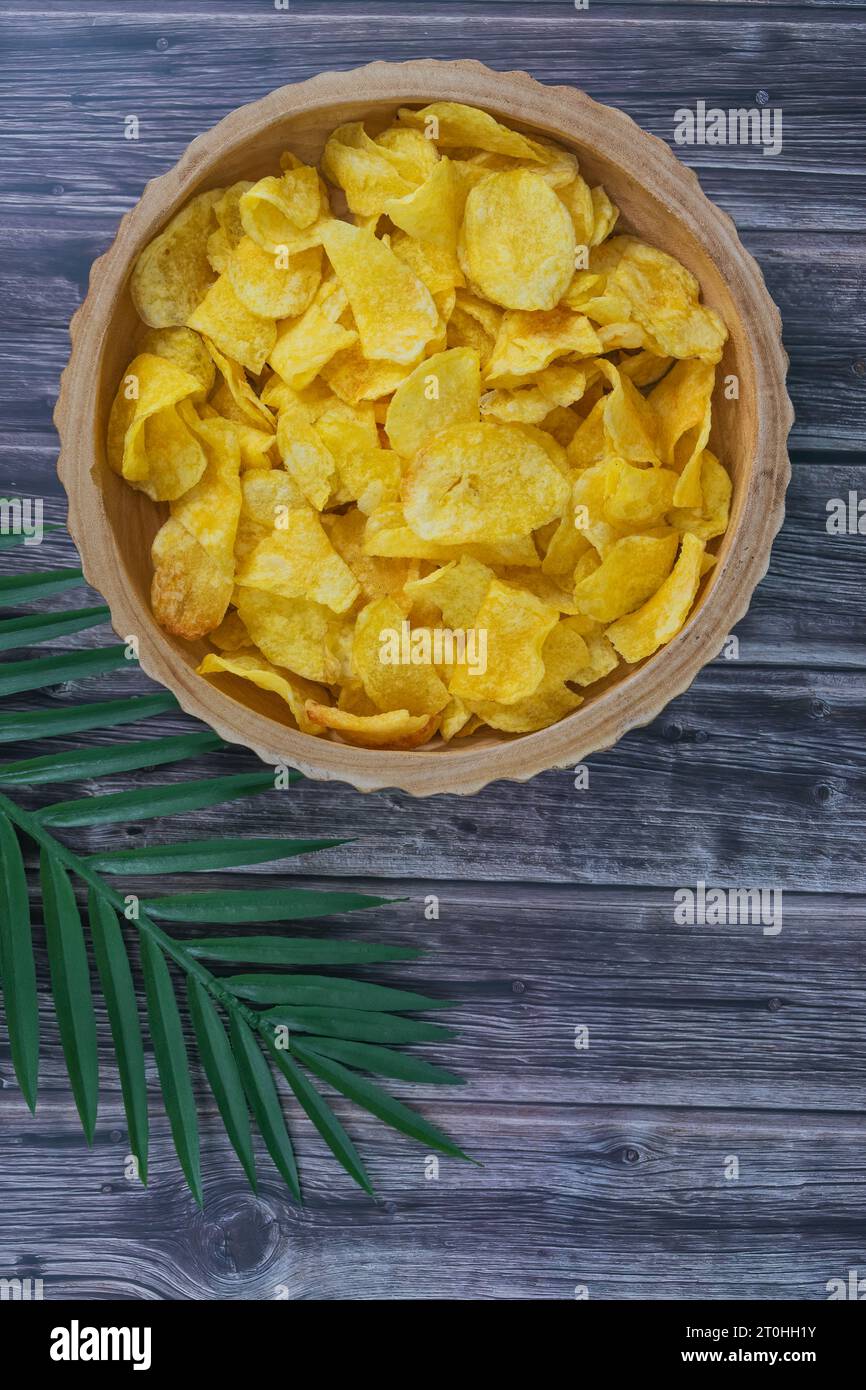 Rustic Delight: Golden Potato Chips in a Wooden Bowl - Tempting and ...