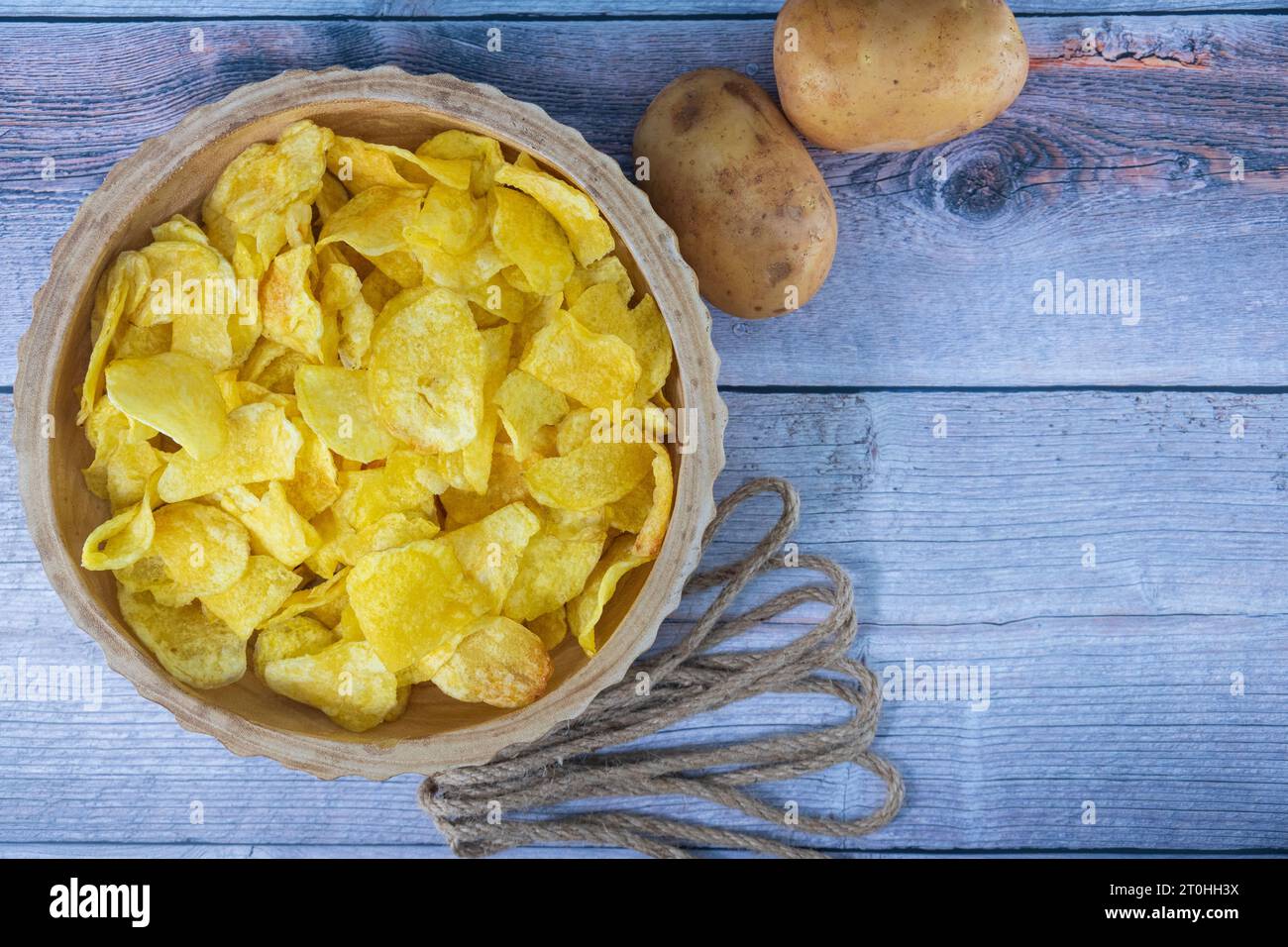 Rustic Delight: Golden Potato Chips in a Wooden Bowl - Tempting and ...