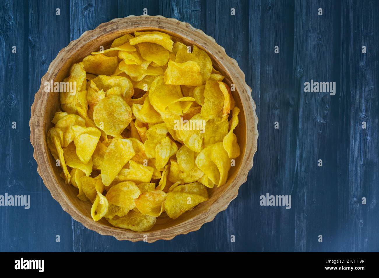 Rustic Delight: Golden Potato Chips in a Wooden Bowl - Tempting and ...