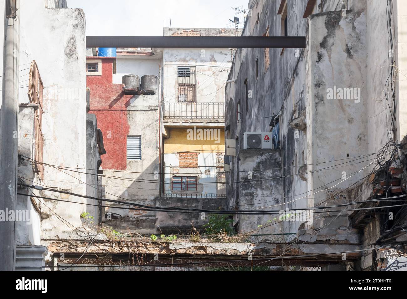 Scene of a collapsed residential building. Weathered run down walls of ...