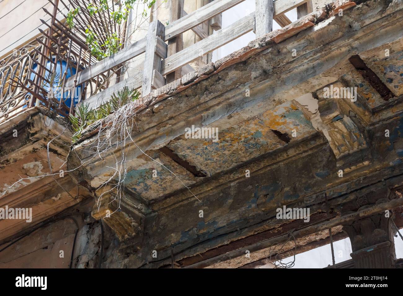 Low angle of a run down balcony structure which is part of a collapsed ...
