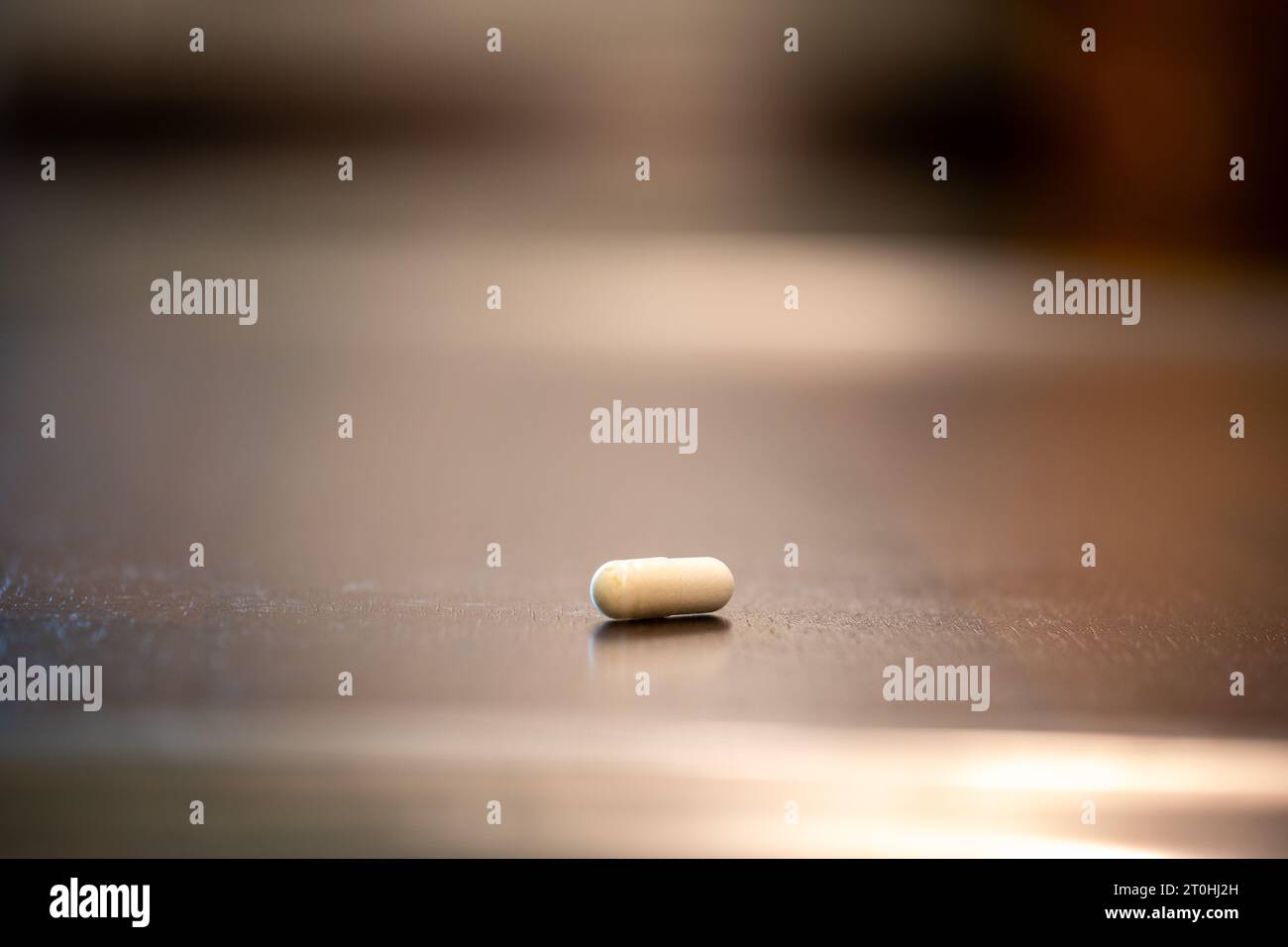 Single capsule with alpha lipoic acid on a kitchen counter Stock Photo ...