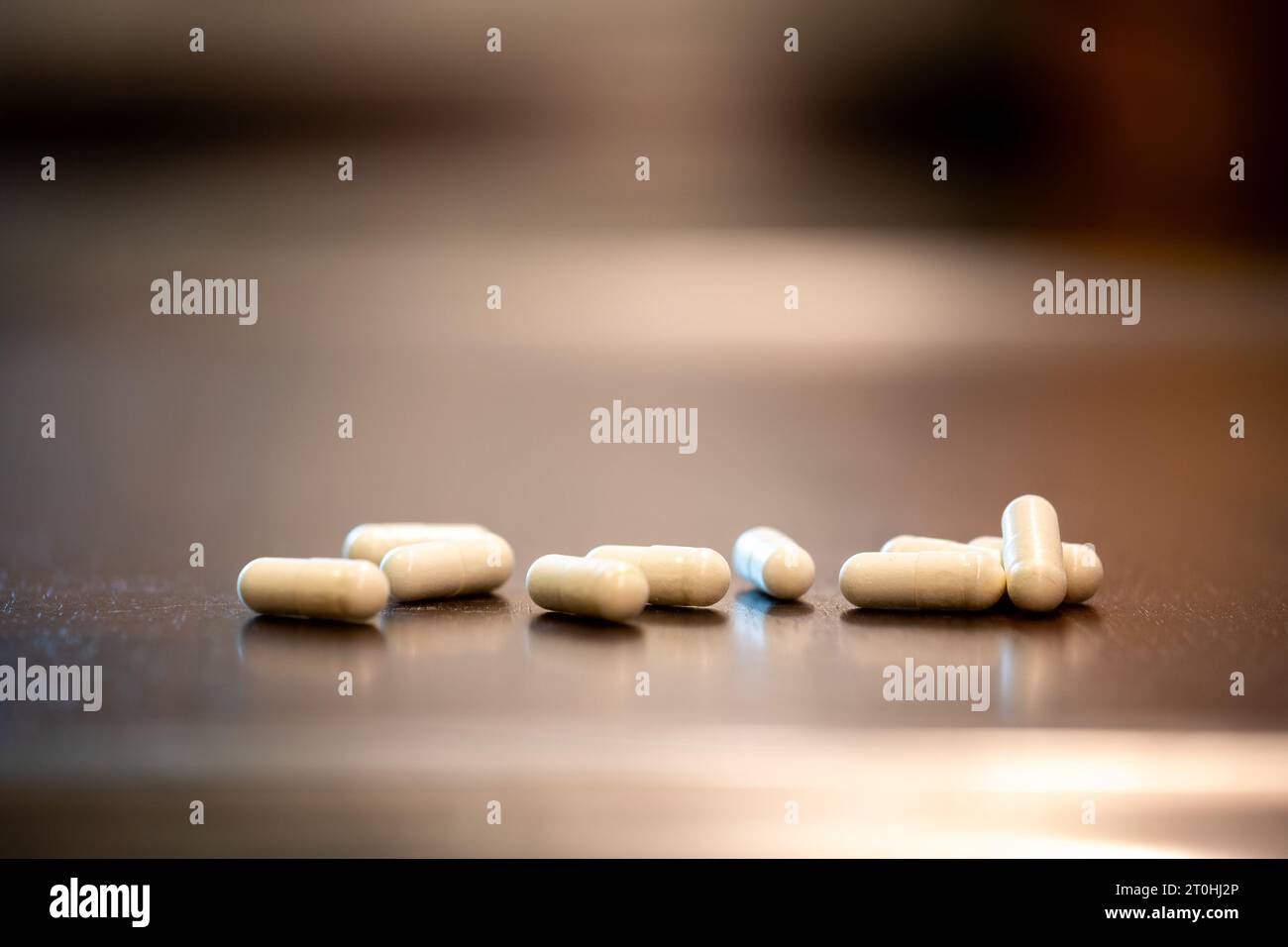 Multiple capsules with alpha lipoic acid on a kitchen counter Stock ...