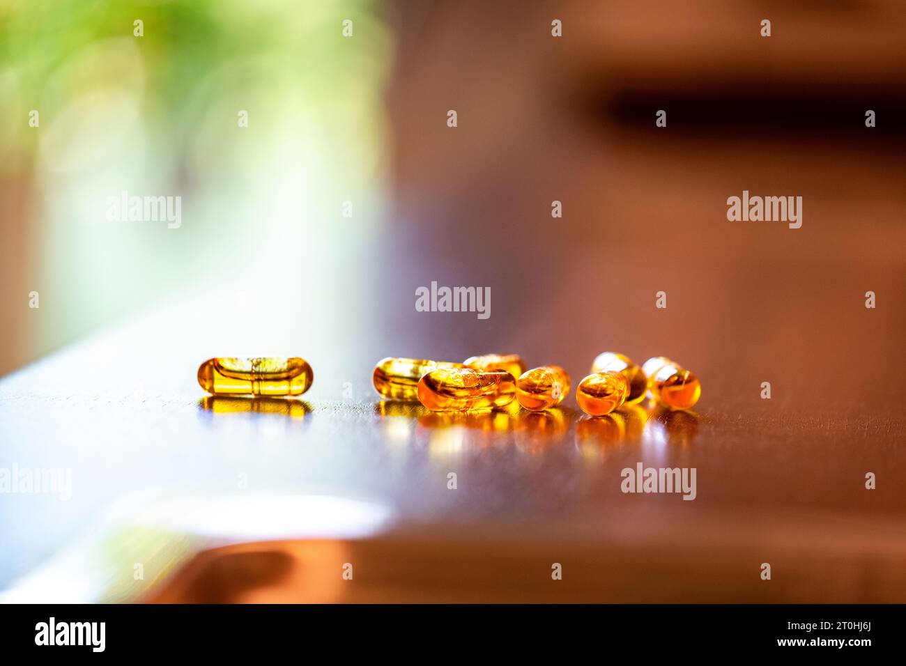 Multiple capsules with coenzyme Q10 coq10 on a kitchen counter Stock ...