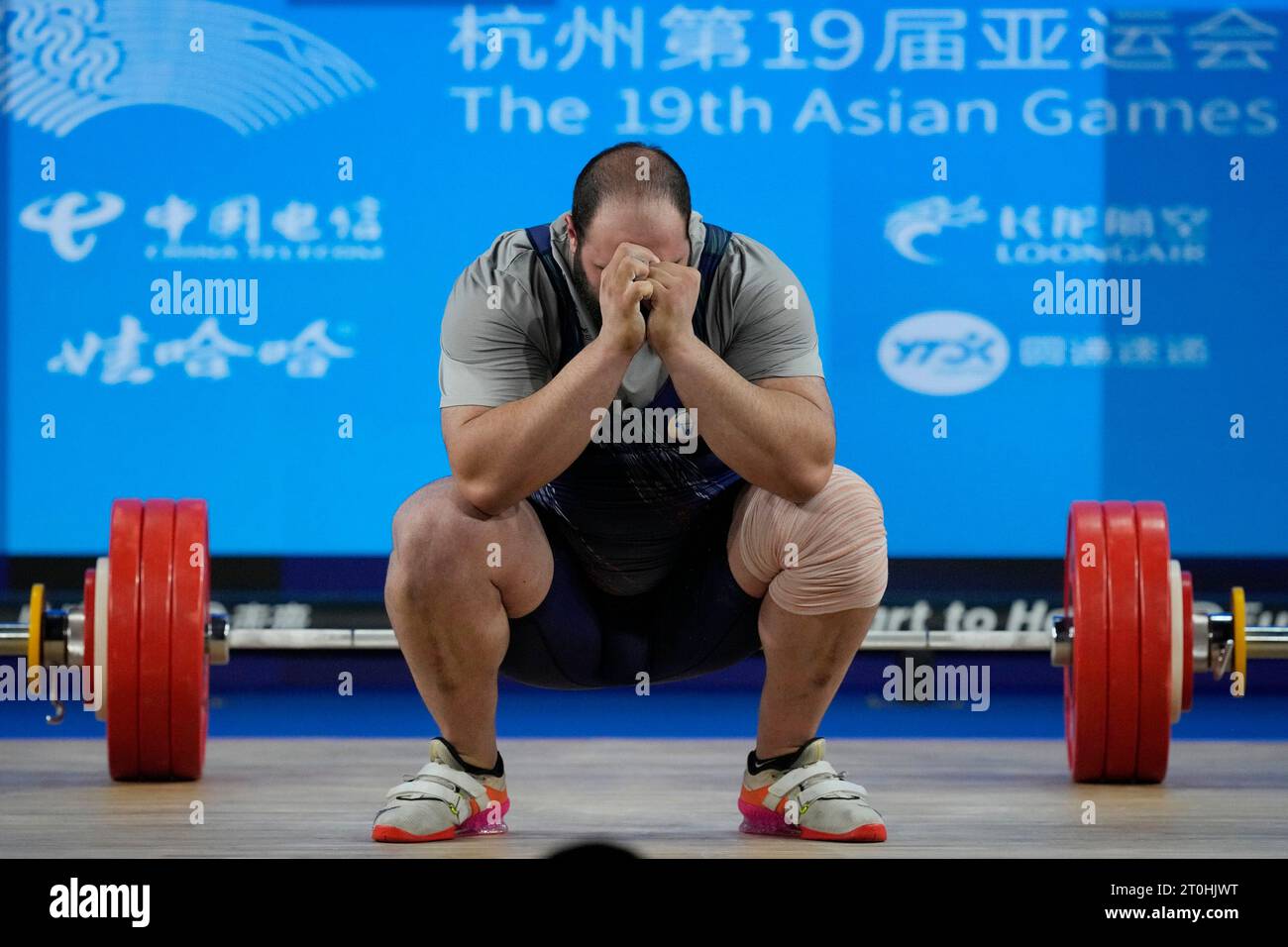 Ayat Sharifikelarijani of Iran gestures as he competes at the mens ...