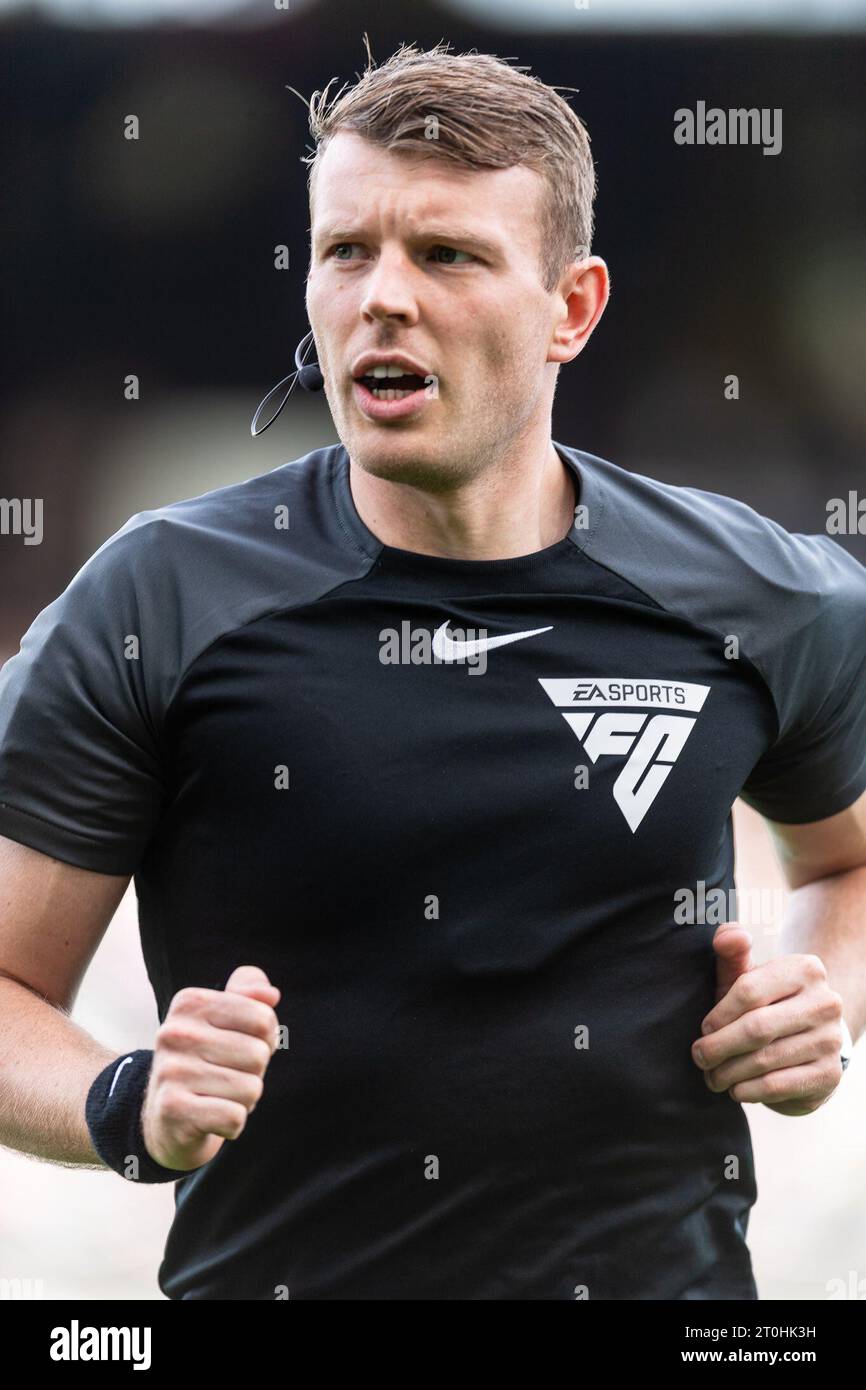 Referee Samuel Barrett warms up ahead of the Premier League match between Fulham and Sheffield ...