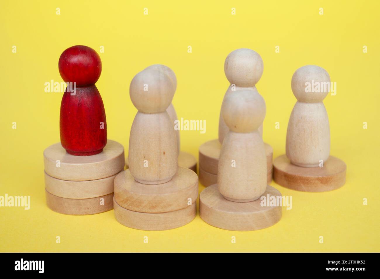 Leadership concept, red figure leading the rest of figures on yellow ...