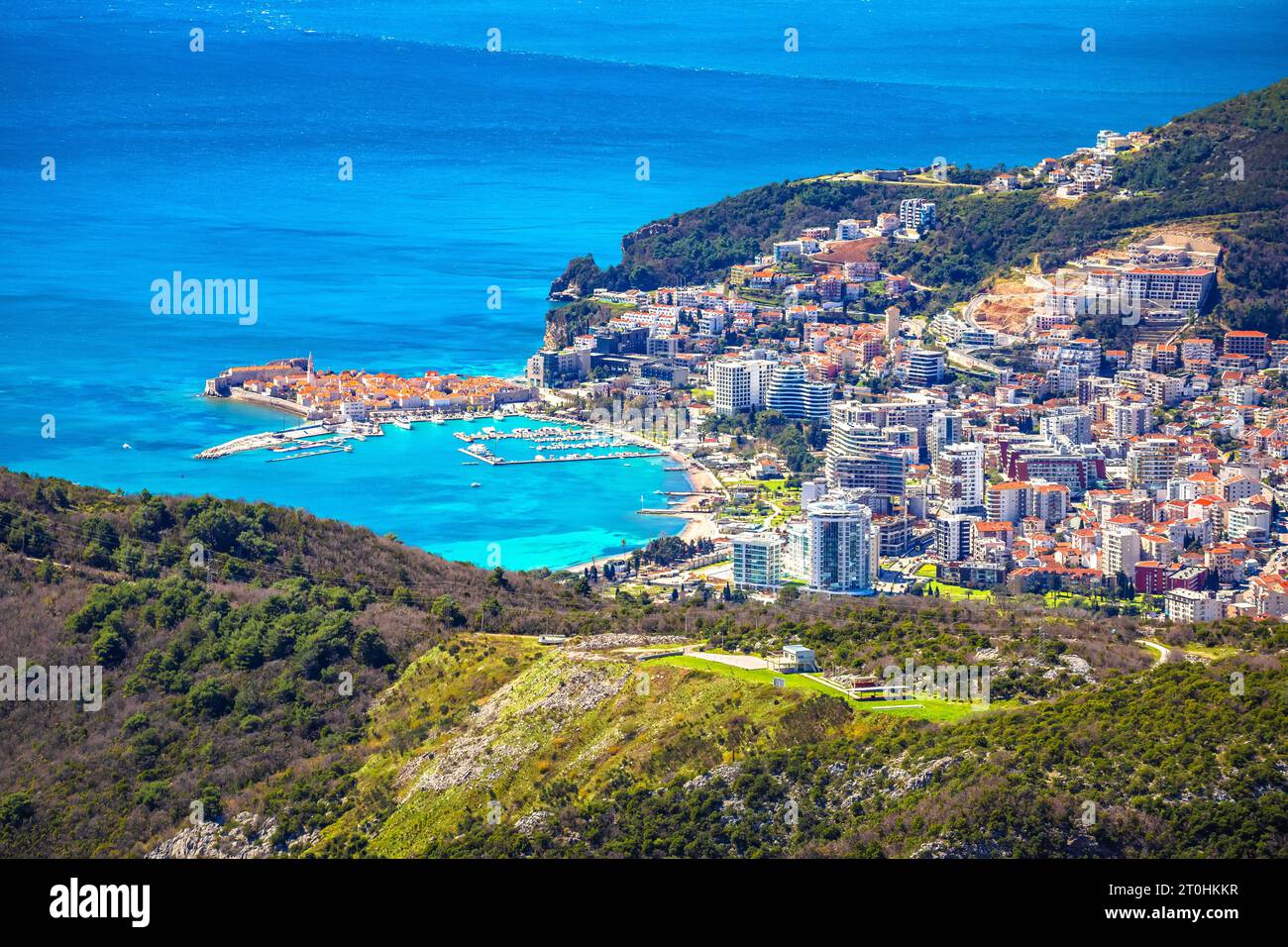 Town of Budva beach and modern coastline architecture view from hill ...