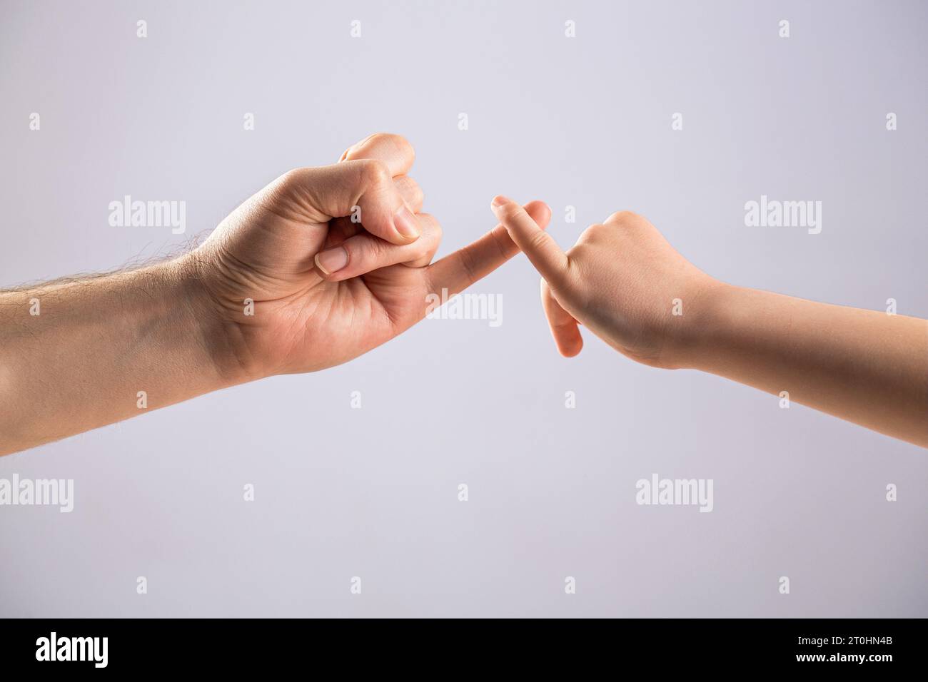 Show friendship and forgiveness. Father, daughter hand making promise ...