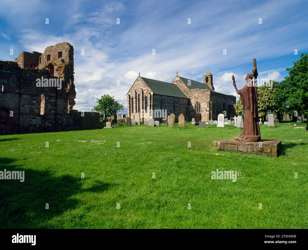 View SW of a cement & red sandstone statue of St Aidan, made in 1958 by ...