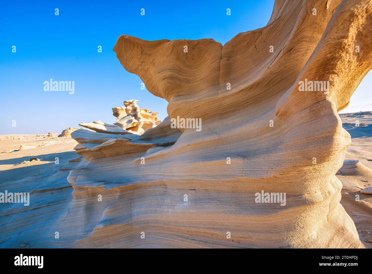 Desert eroded rock pattern with clear sky. Desert rock formation with ...