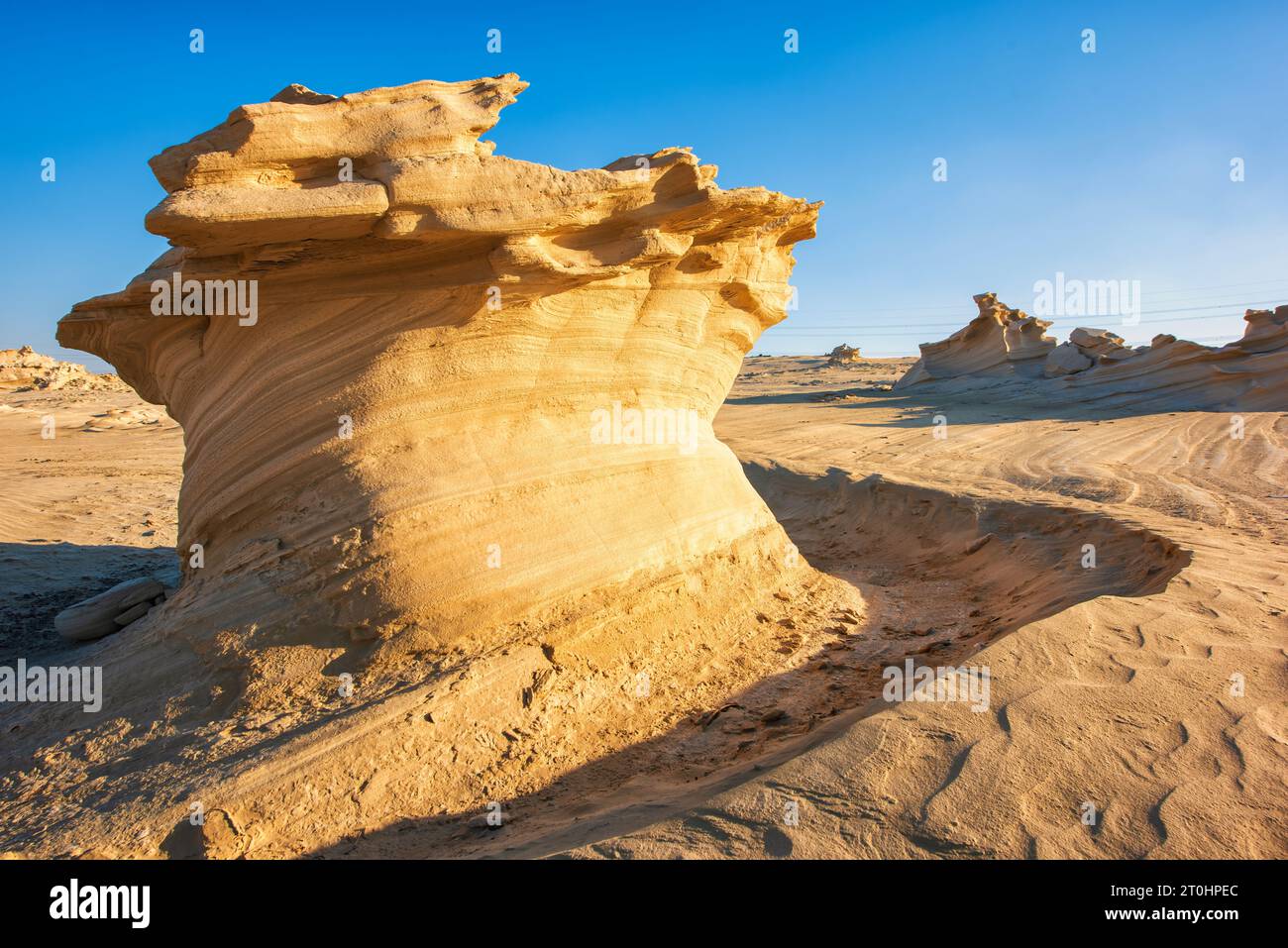 Desert eroded rock pattern with clear sky. Desert rock formation with ...