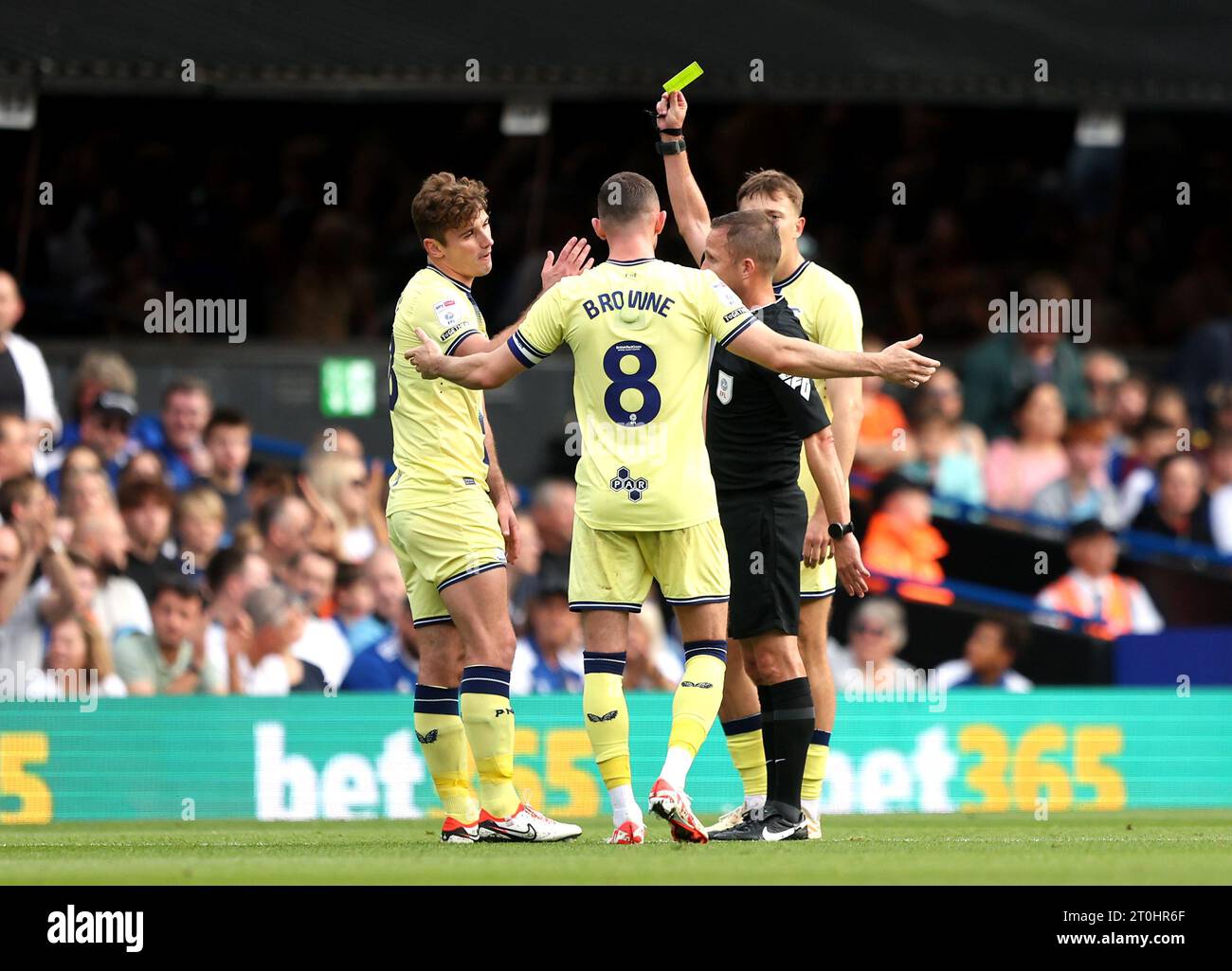 Preston North End's Ryan Ledson is shown a yellow card by referee David ...