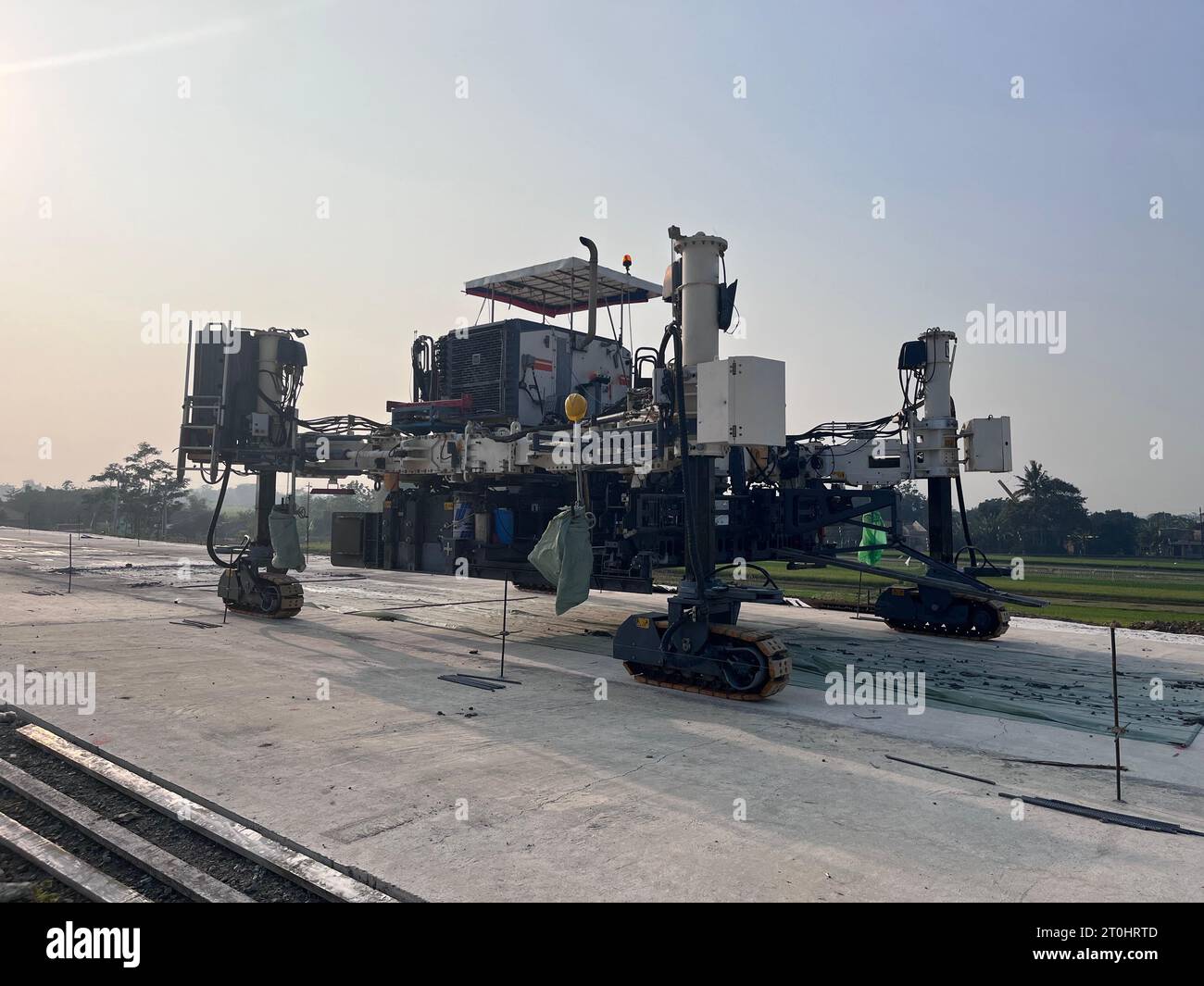 machine. Slipform paver machine on road work at construction site ...