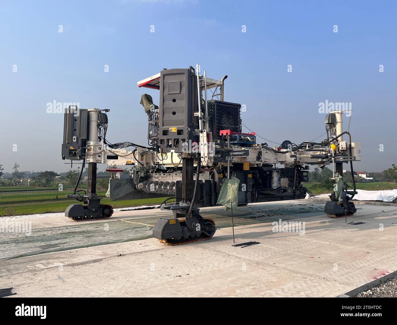 machine. Slipform paver machine on road work at construction site ...