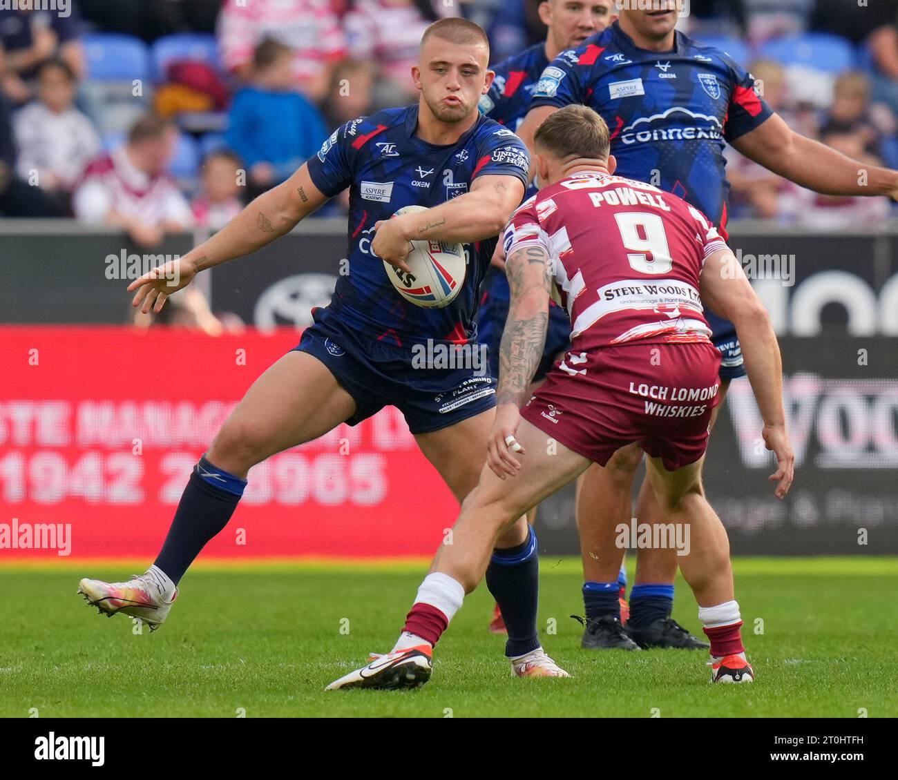 Wigan, UK. 07th Oct, 2023. Mikey Lewis #20 of Hull KR runs at Sam ...
