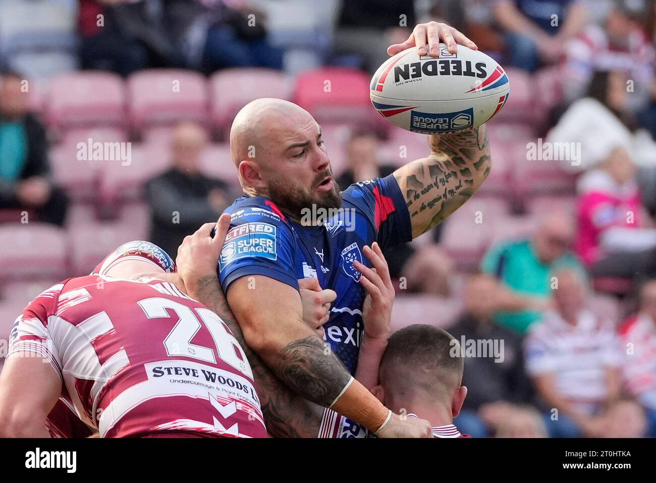 Sam Luckley #26 of Hull KR offloads the ball during the Betfred Super ...