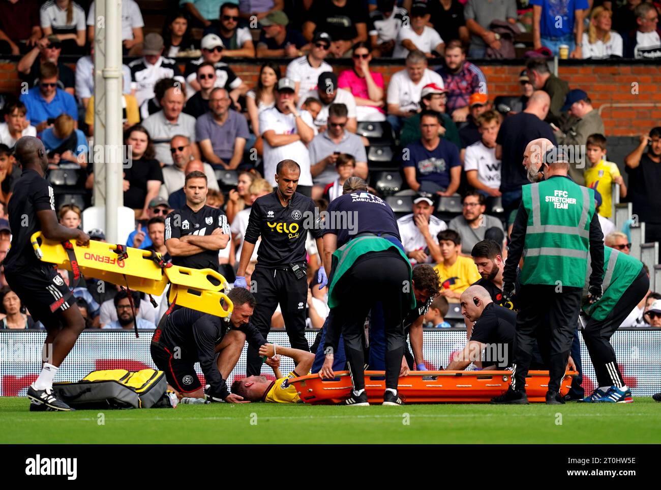 Sheffield United's Chris Basham requires medical attention after ...