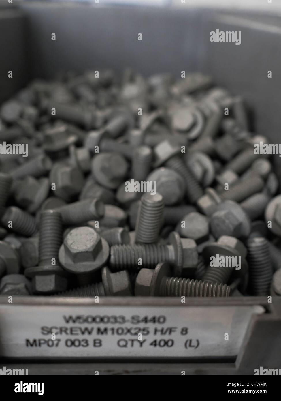 A tub of screw fasteners on the production line at the Aston Martin ...