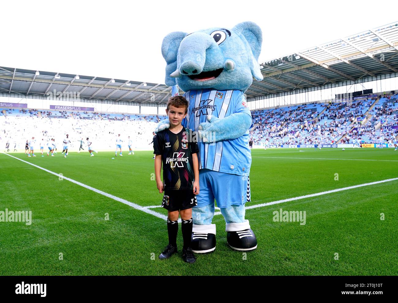 A Coventry City match day mascot poses for a photo with Sky Blue Sam ...