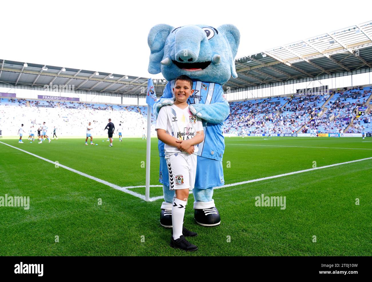 A Coventry City match day mascot poses for a photo with Sky Blue Sam ...