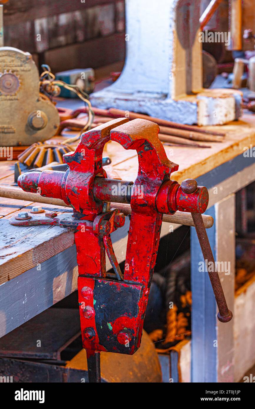 Antique red bench vice in the Britannia Ship Yard in Steveston Canada ...