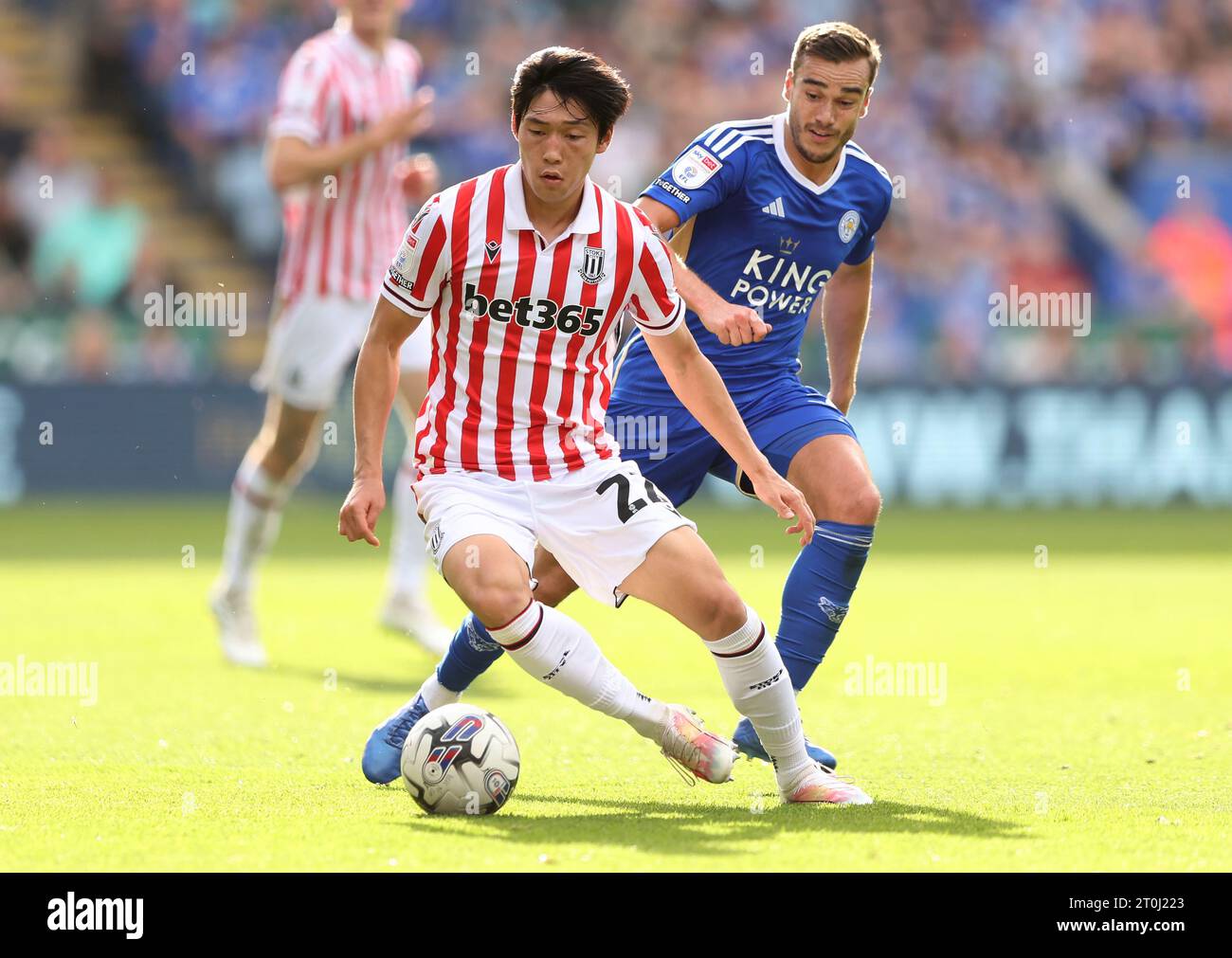 Stoke City's Bae Jun-Ho (left) and Leicester City's Harry Winks in ...