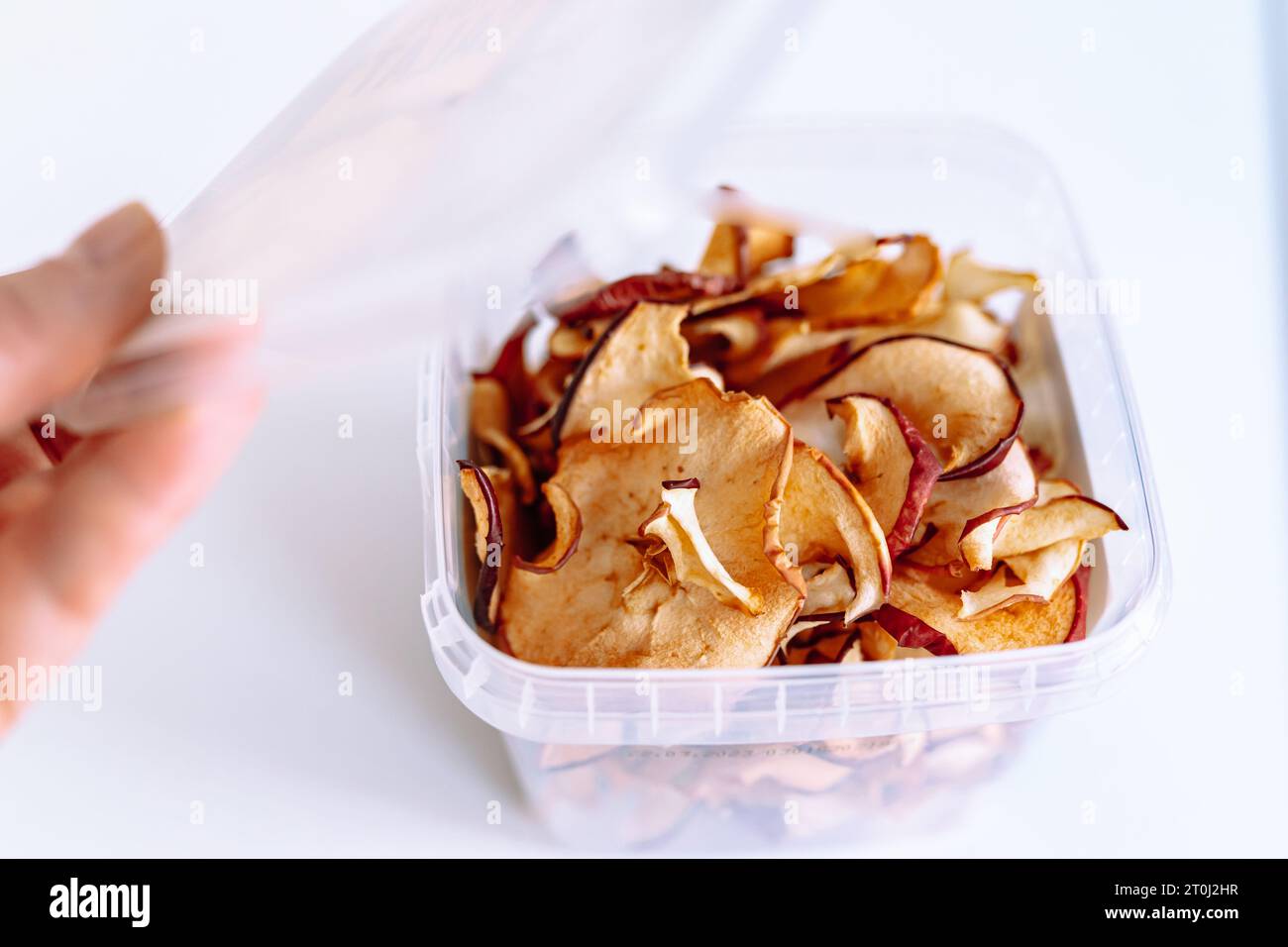 storing apple chips in an eco-plastic box Stock Photo - Alamy