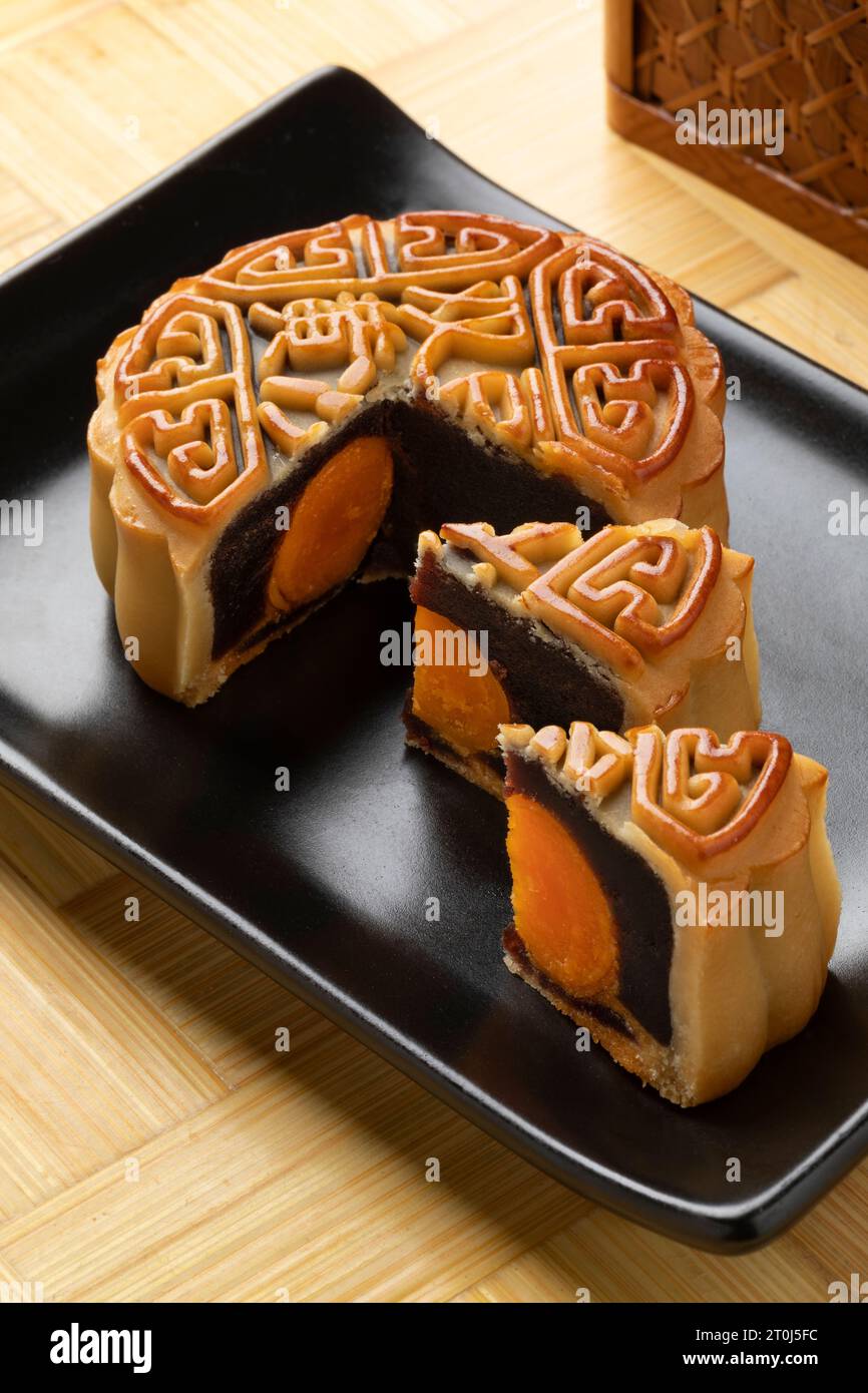 Fresh baked traditional Chinese mooncake with a filling of red bean ...
