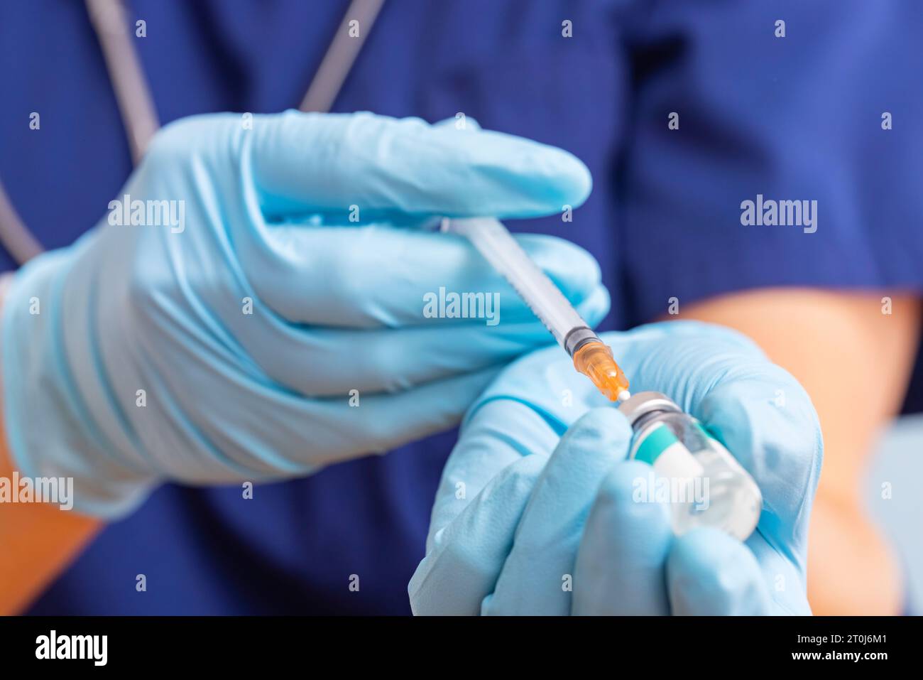 Doctor fills syringe with medicine from vial. Vaccination and immunization Stock Photo - Alamy