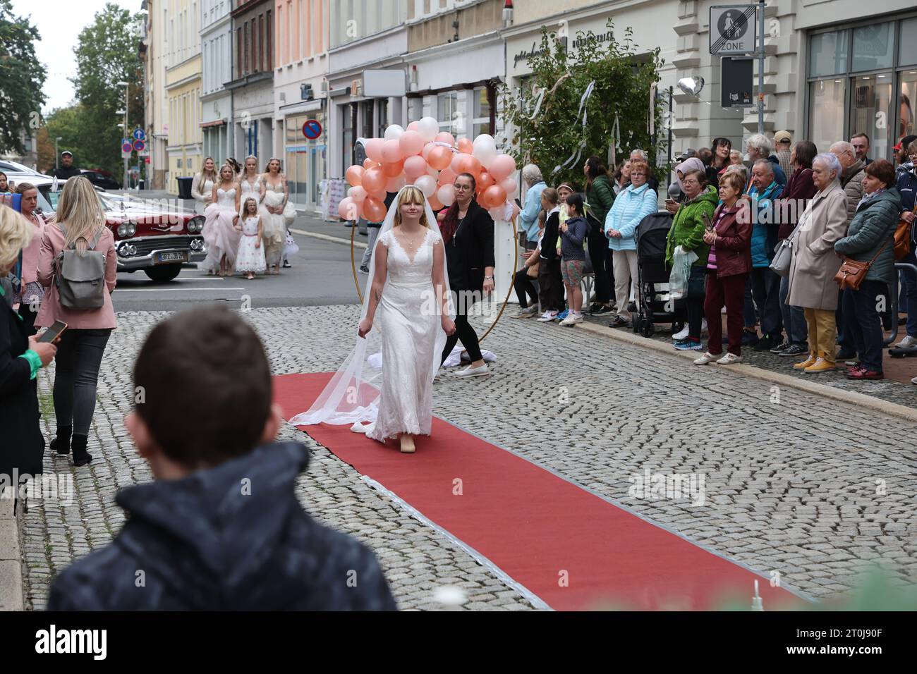 Gera, Germany. 07th Oct, 2023. A model walks down a red carpet at a ...