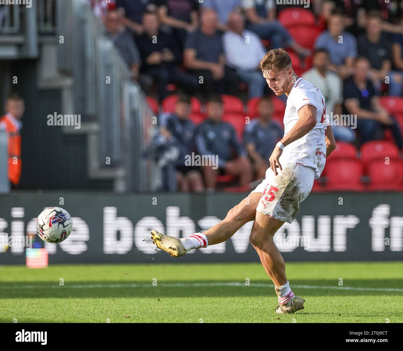 John Mcatee #45 of Barnsley shoots on goal and just misses the target ...