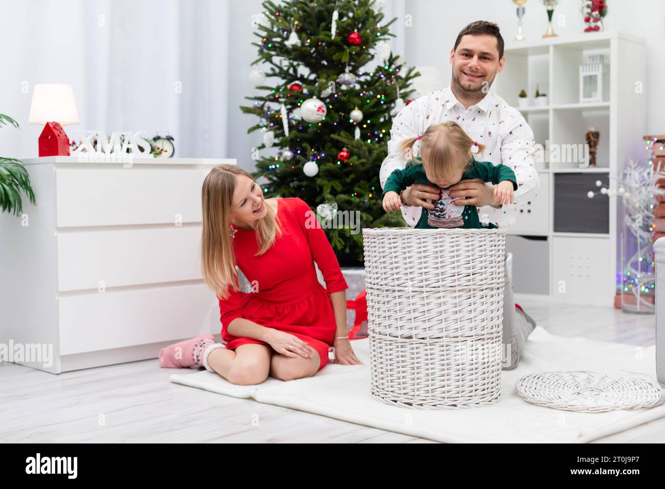 A family of three spends a happy holiday time together Stock Photo - Alamy