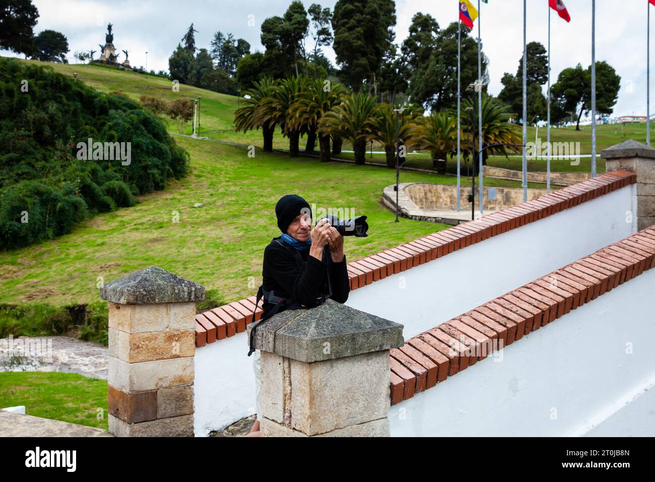 Male tourist taking photos at the famous historic Bridge of Boyaca in ...