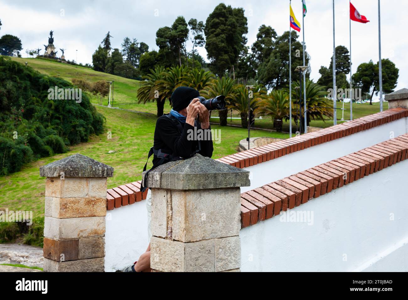 Male tourist taking photos at the famous historic Bridge of Boyaca in ...