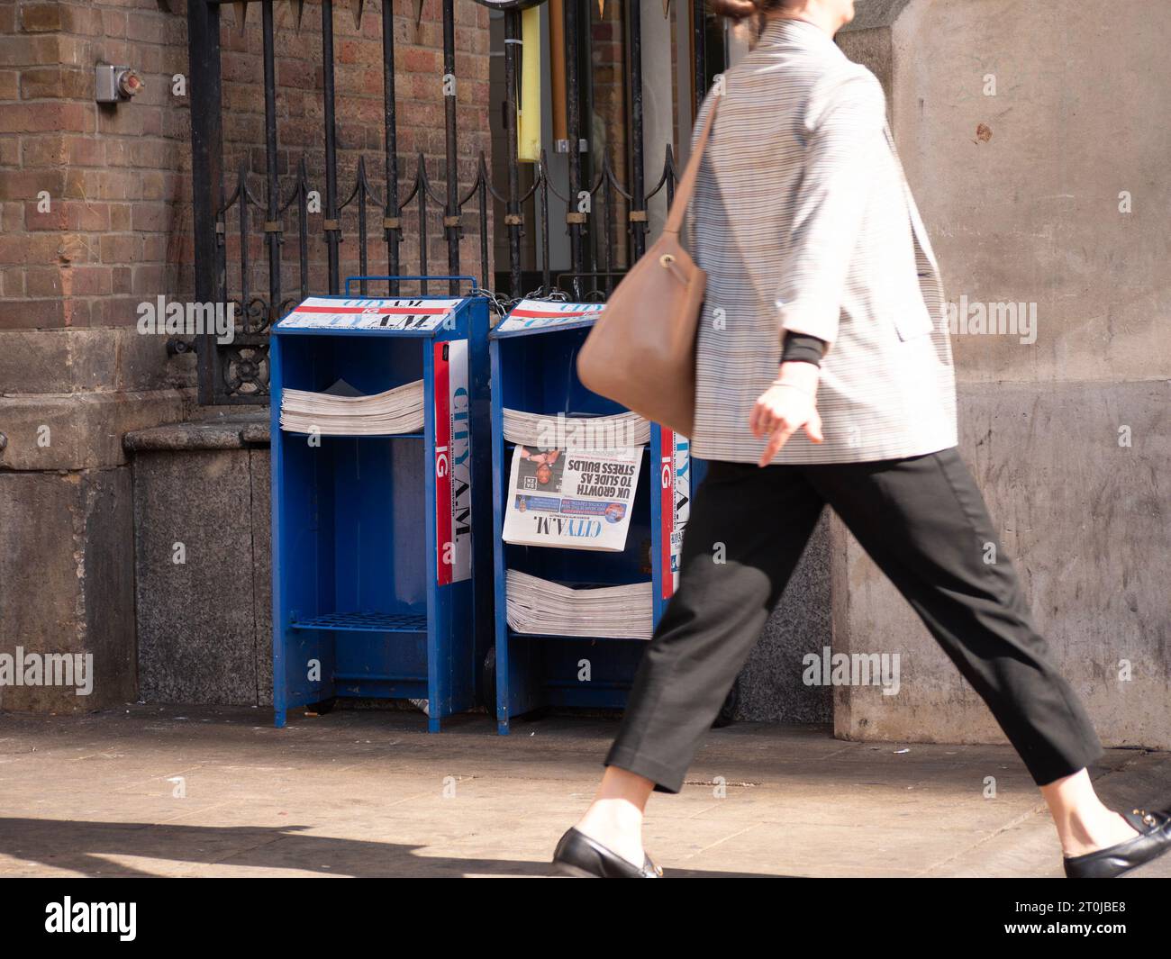 City AM freesheet newspaper stand Liverpool Street Station, LondonUK ...
