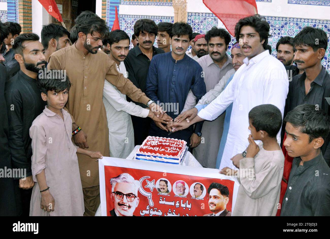 Leaders and members of Sindh Hari Committee cut cake during birthday ...