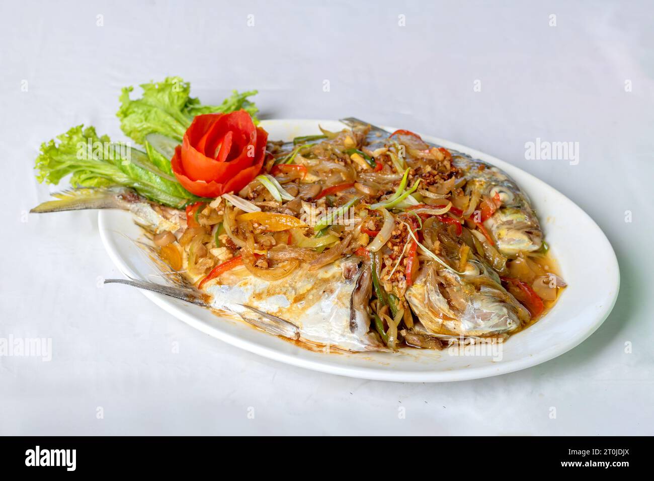 steamed pompano or kuwe fish with sweet and spicy sauce and beautiful ...