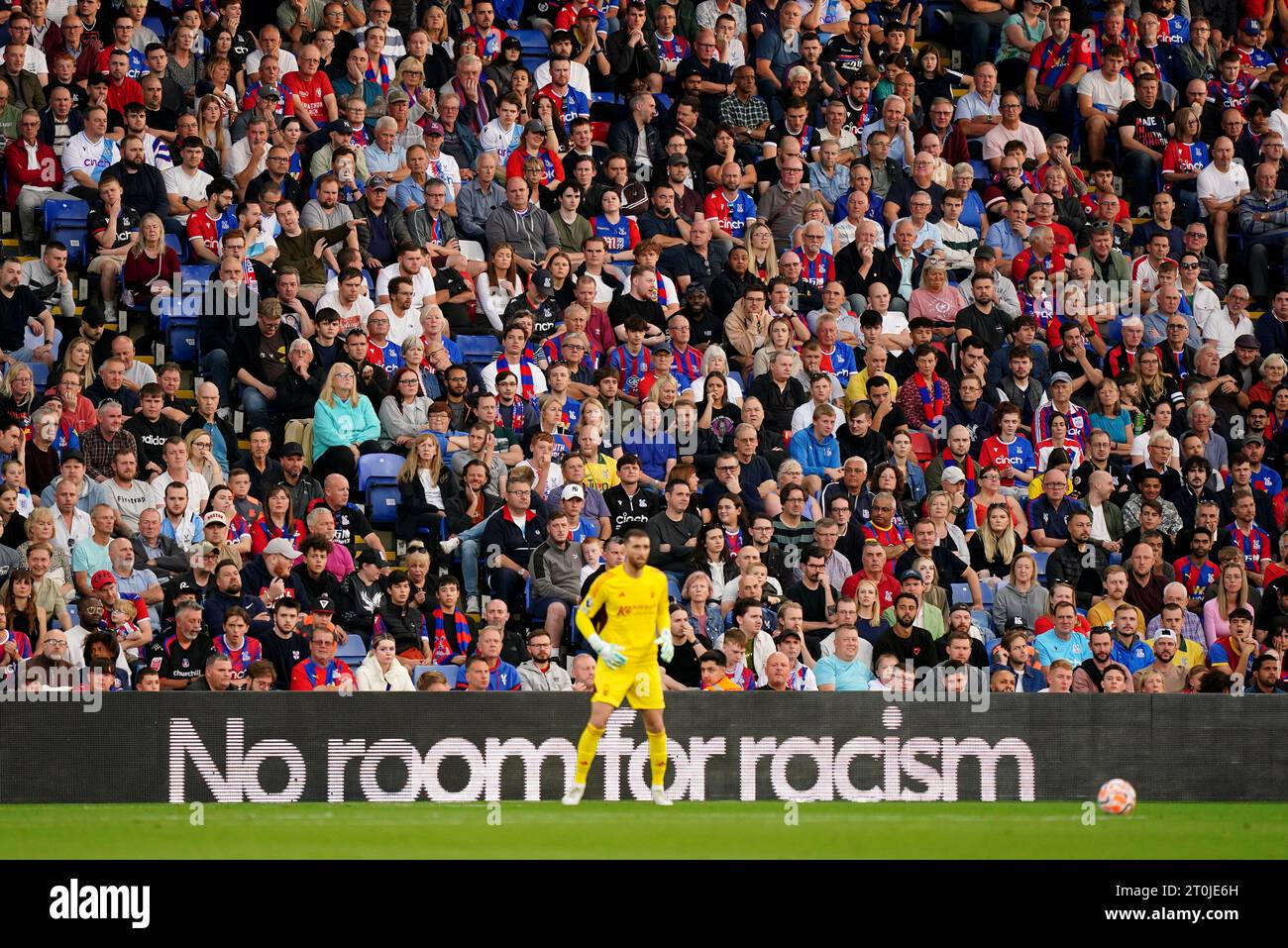 A pitch side advertisement screen displays No Room for Racism during ...