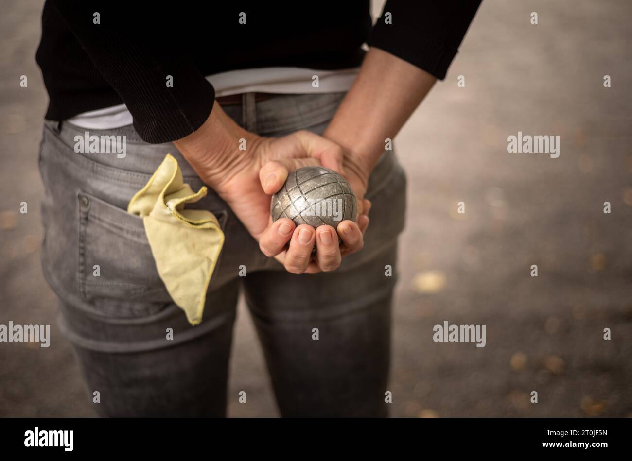 Munich, Germany. 07th Oct, 2023. A woman holds her last boules balls in ...