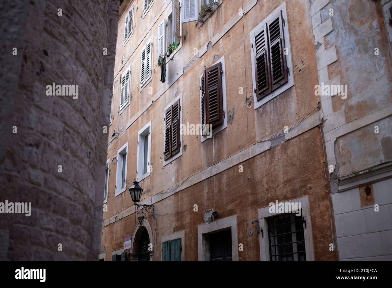 View of an ancient residential building in Kotor Old Town, Montenegro ...