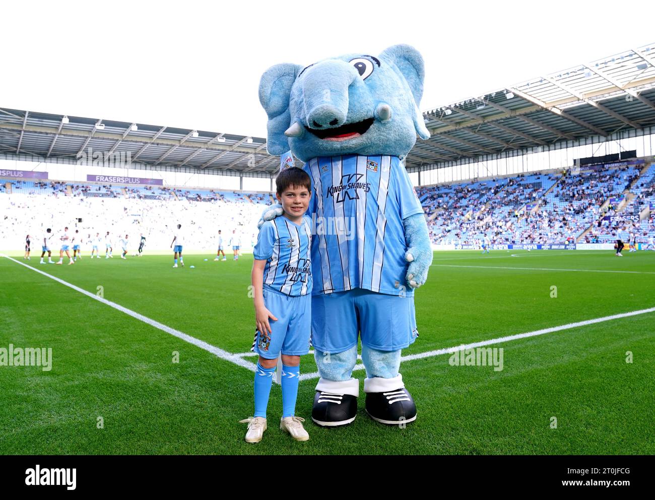 A Coventry City match day mascot poses for a photo with Sky Blue Sam ...