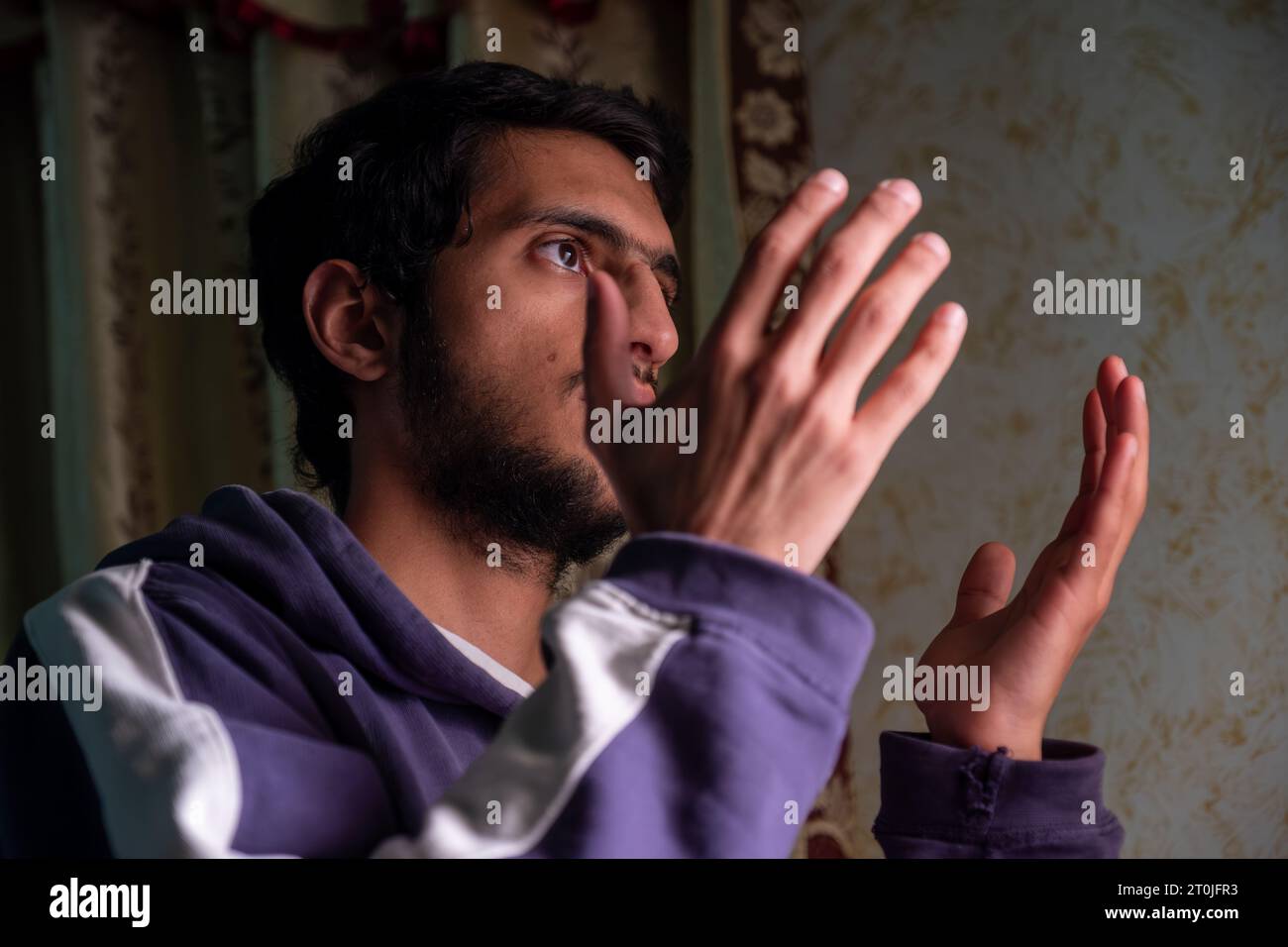 muslim male rising his hands to pray for allah and asking for ...